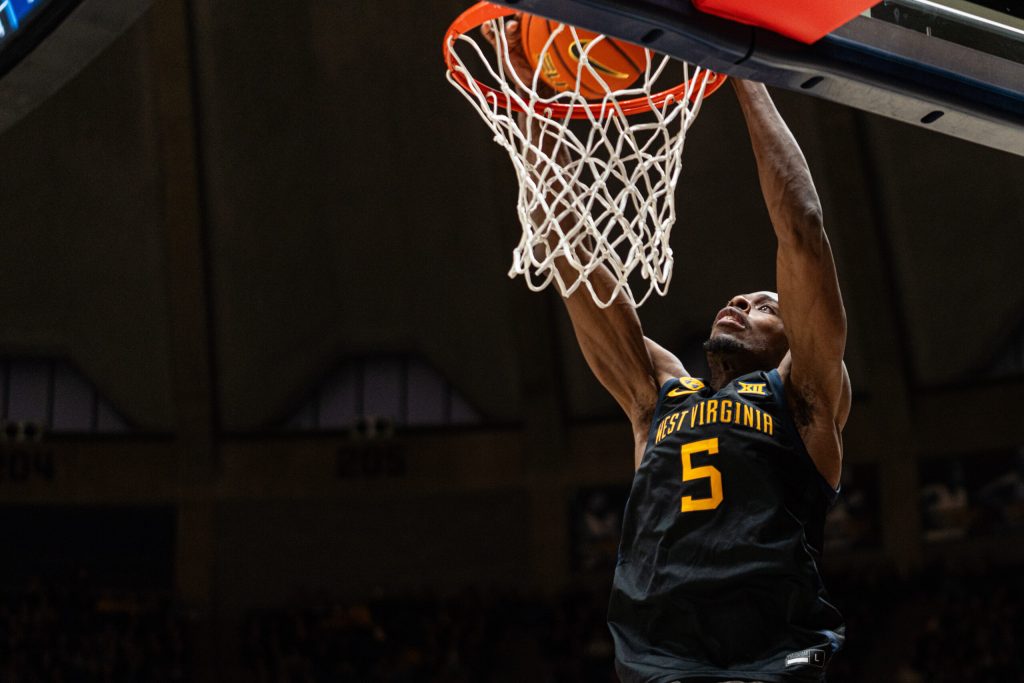 Okani drives Mountaineers past Utes - Herald-Standard